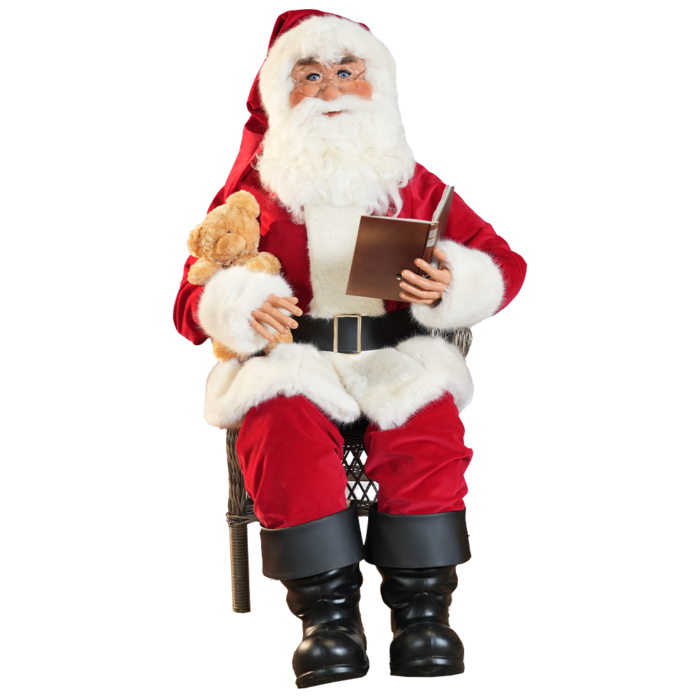 Animatronic Santa Claus sitting in a chair, reading a book - Creation Group